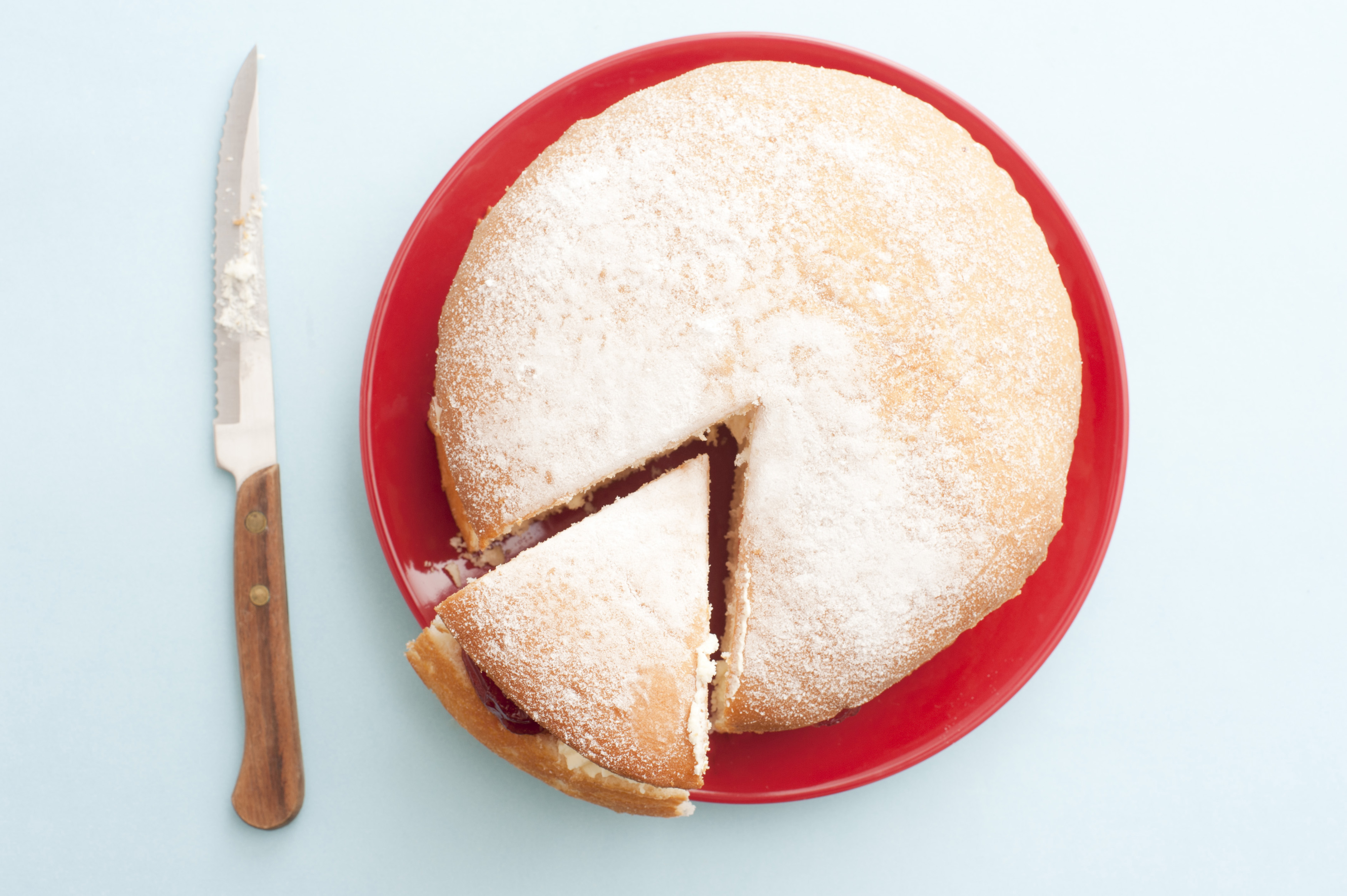 Sliced wedge of delicious cake in plate - Free Stock Image