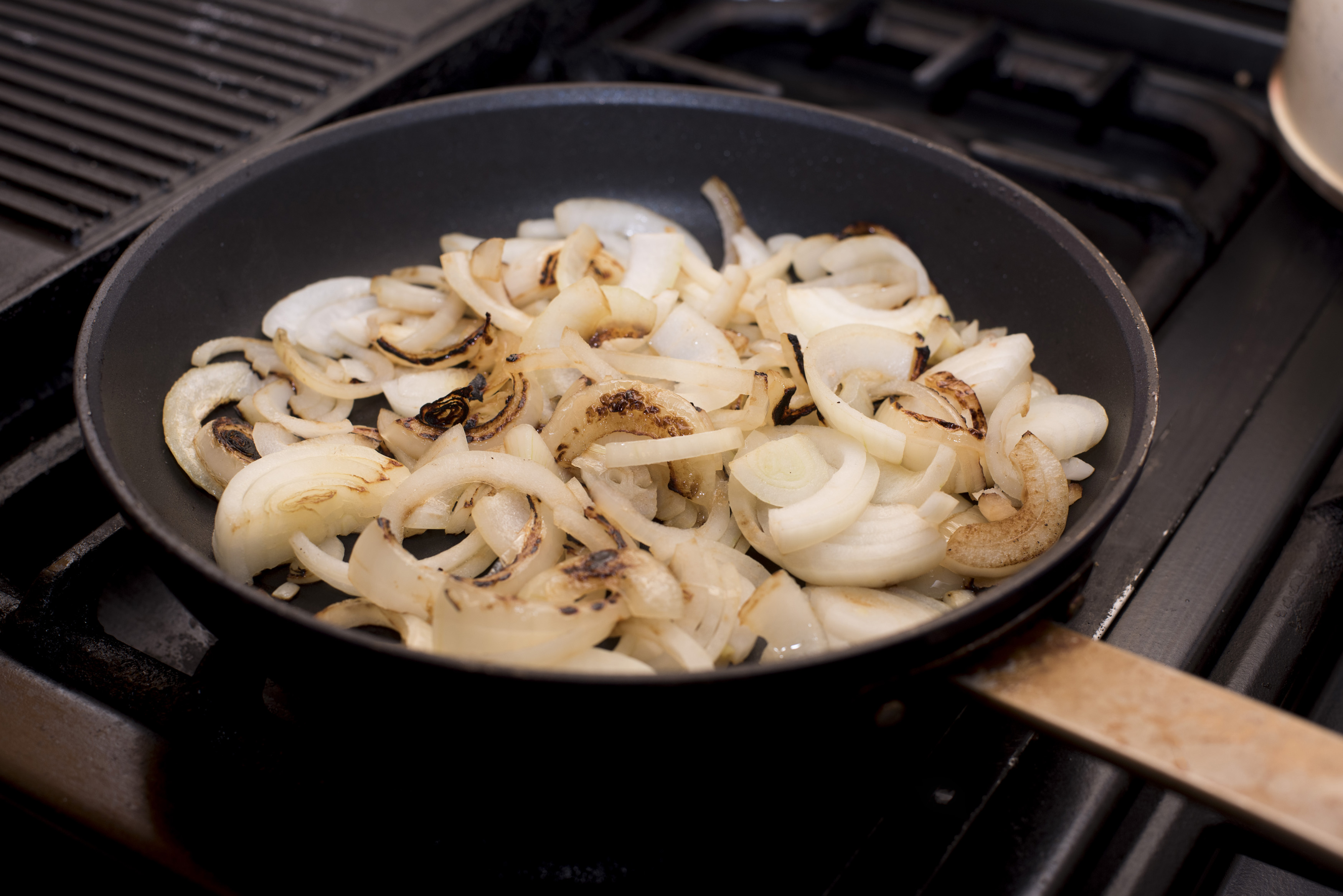 Browning fresh diced onions - Free Stock Image